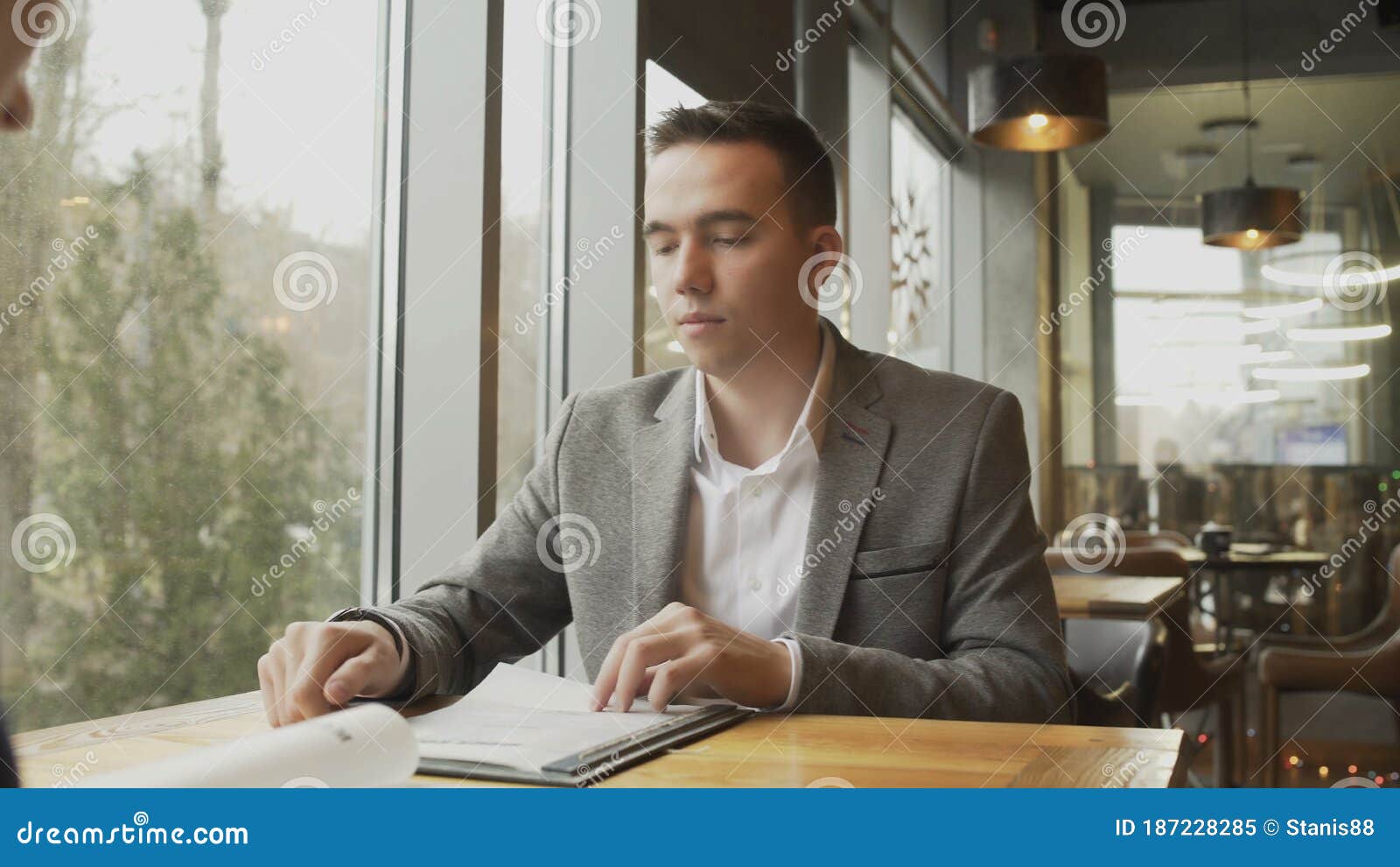 Man Reading Menu in a Restaurant Stock Image - Image of looking, copy ...
