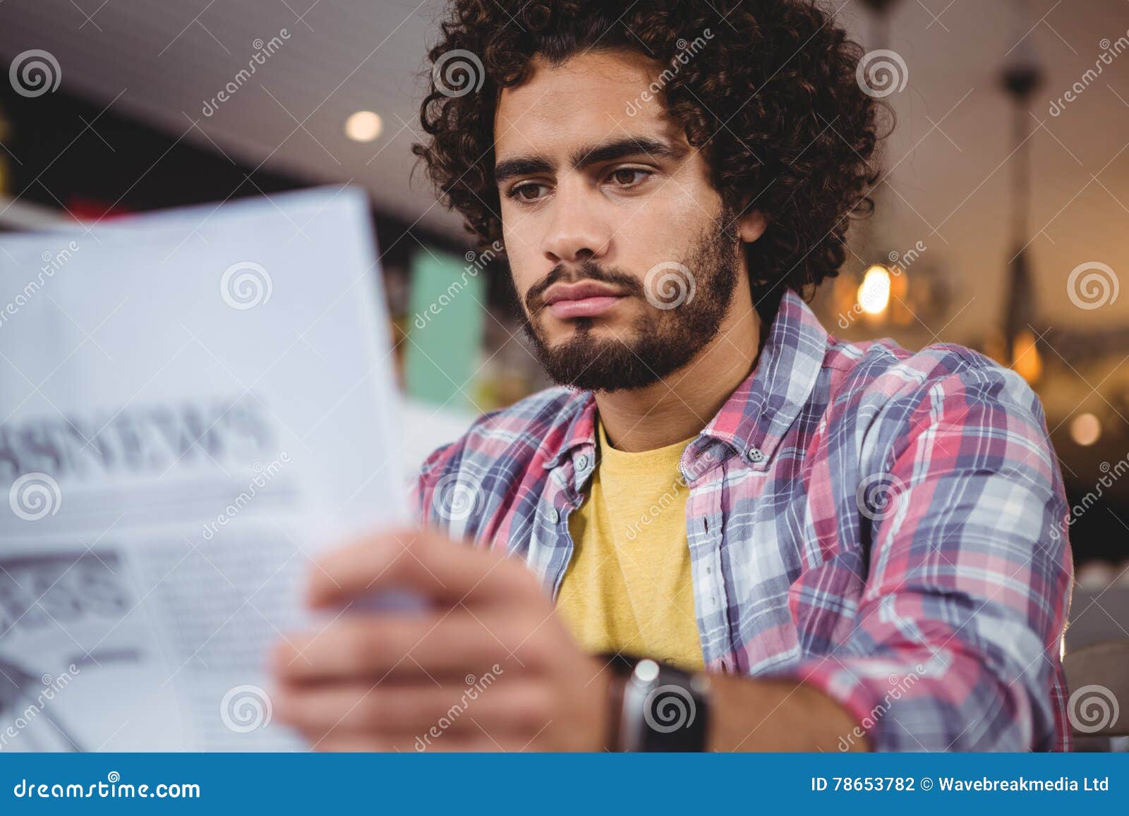 Man reading newspaper stock photo. Image of young, concentration - 78653782