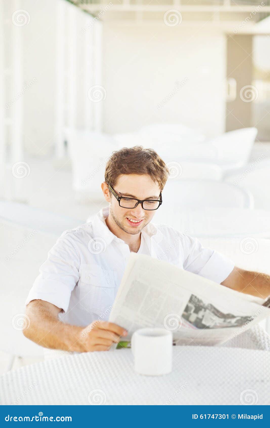 Man reading a newspaper stock image. Image of home, newspaper - 61747301