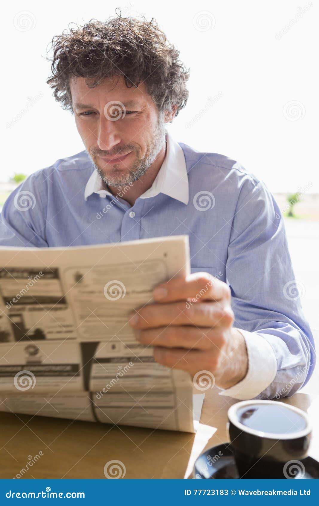 Man reading newspaper stock image. Image of restaurant - 77723183