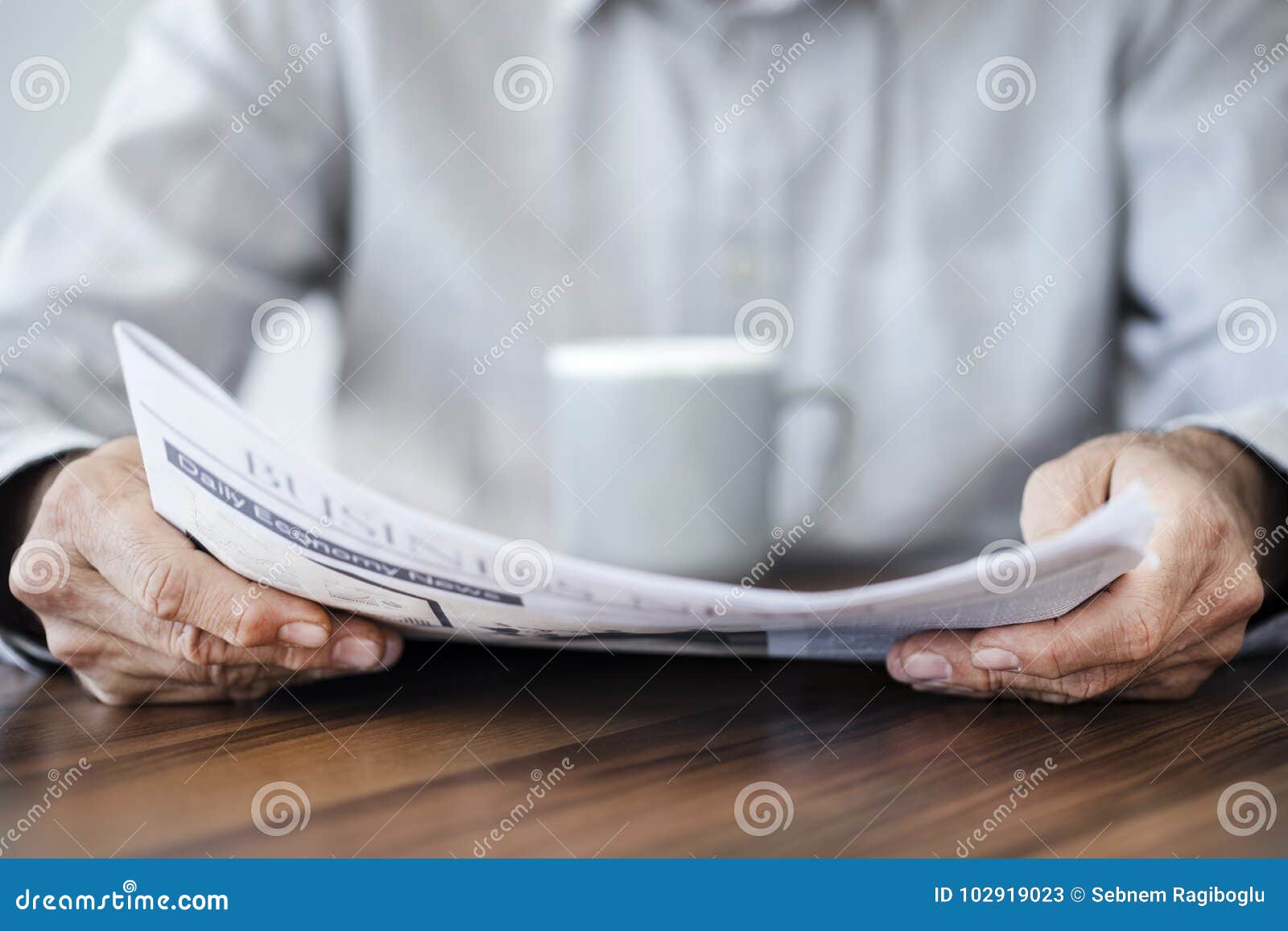 Man Reading Newspaper on Table Stock Image - Image of publishing ...