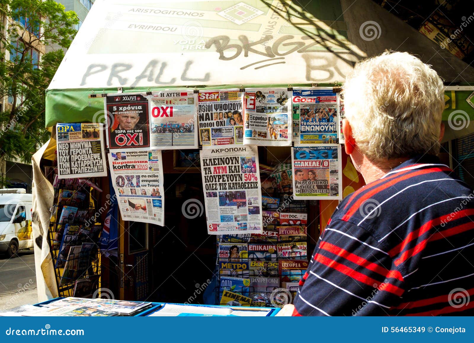 A Man Reading the Newspapers in Athens, Greece Editorial Stock Image ...