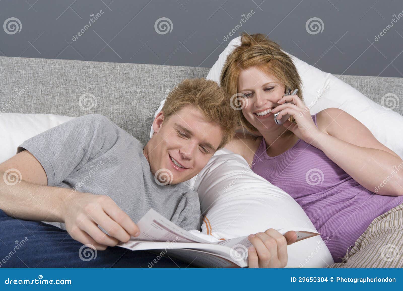 Man Reading Novel while Woman on Call Stock Photo - Image of happy ...