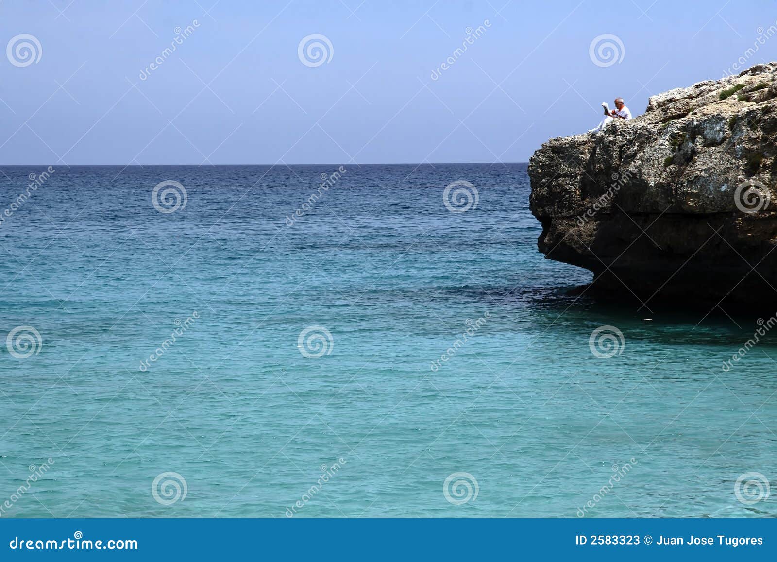 Man Reading Overlooking Ocean Stock Image - Image of beach, vacation ...