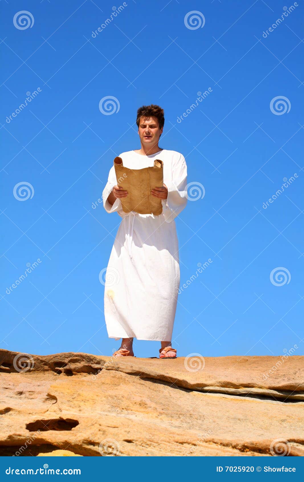 Man Reading Scroll in Rocky Desert Land Scape Stock Photo - Image of ...