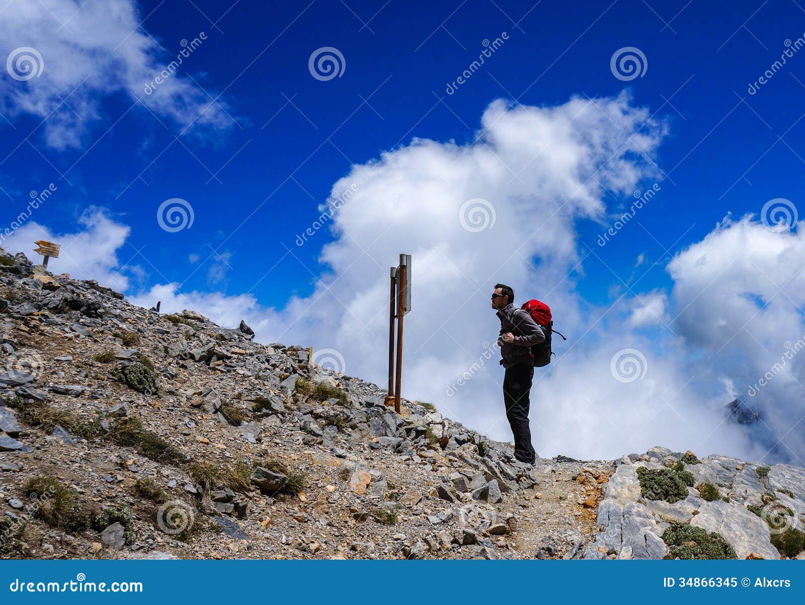 Man Reading a Sign in the Mountains. Stock Image - Image of guide ...