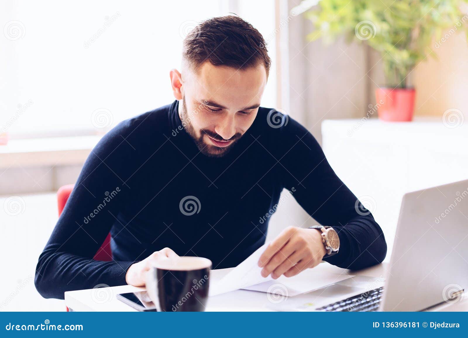 Man Reading and Signing Documents in Office Stock Image - Image of ...