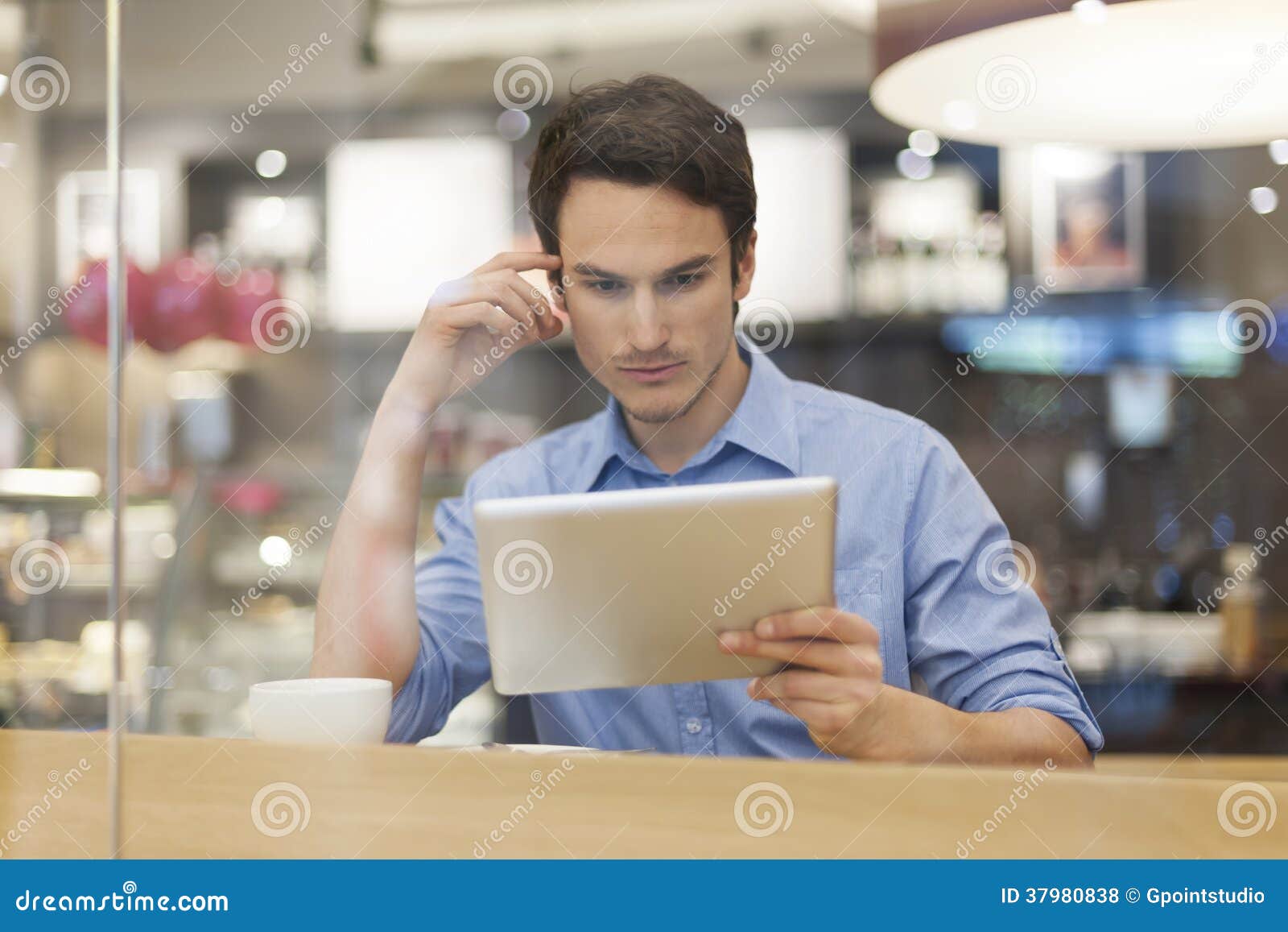 Man Reading Something on Tablet Stock Photo - Image of coffee ...