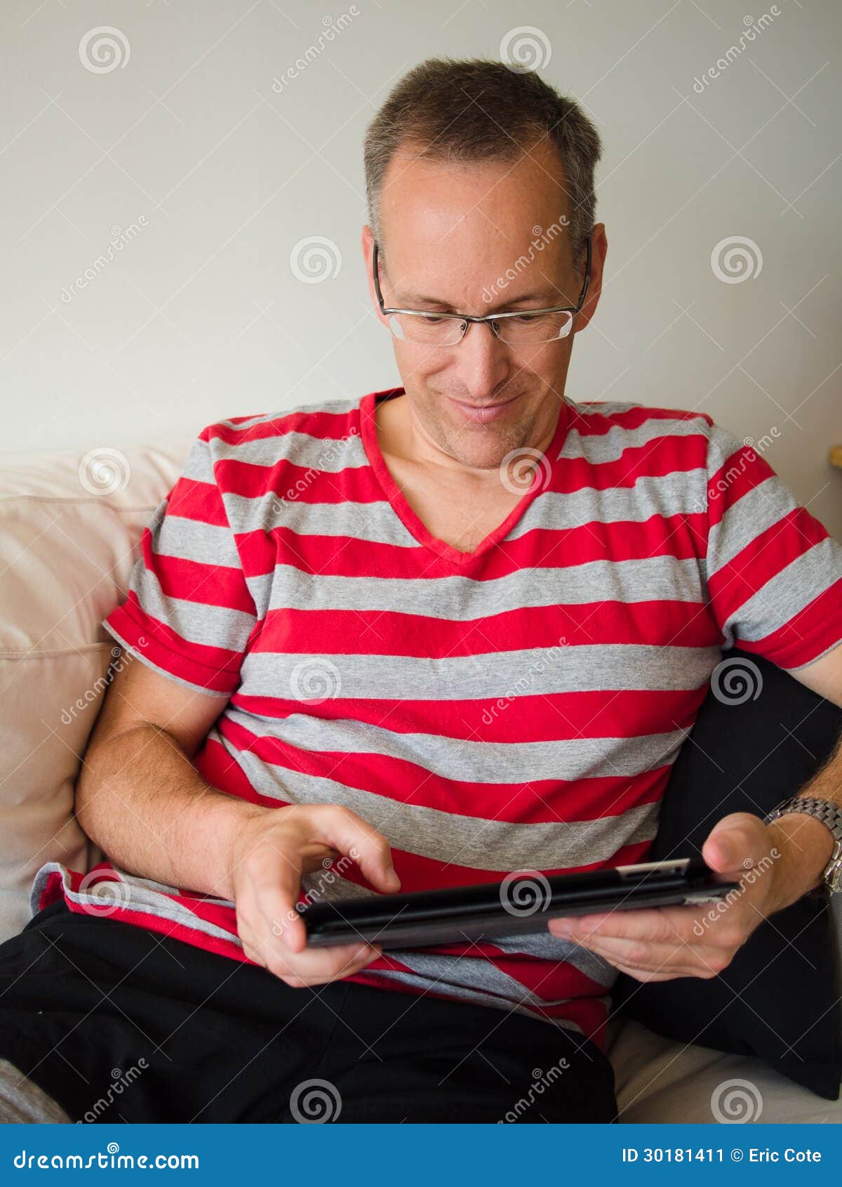 Man with on a tablet stock image. Image of reading, couch - 30181411