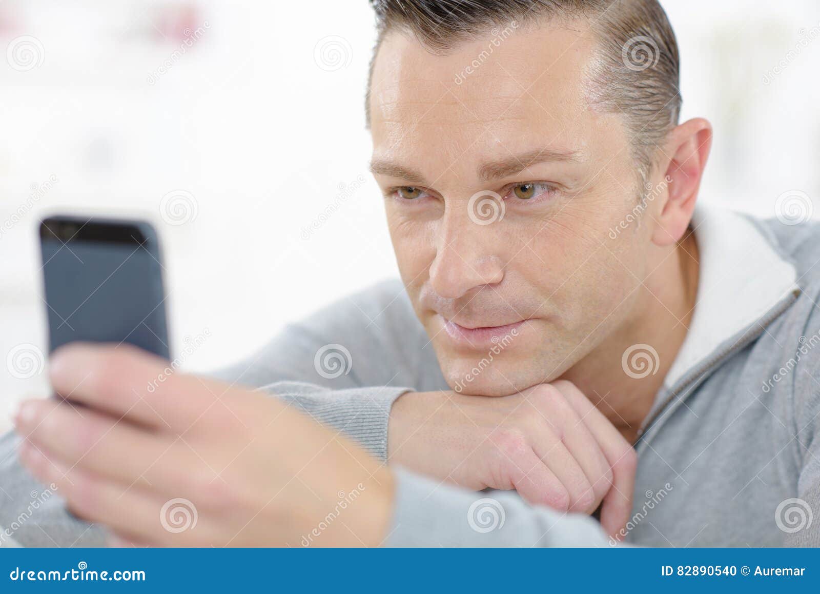 Man reading text message stock photo. Image of handsome - 82890540