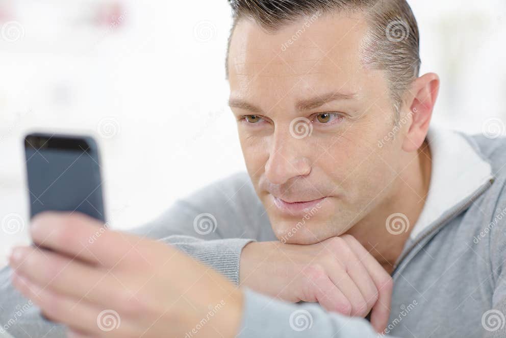 Man reading text message stock photo. Image of handsome - 82890540