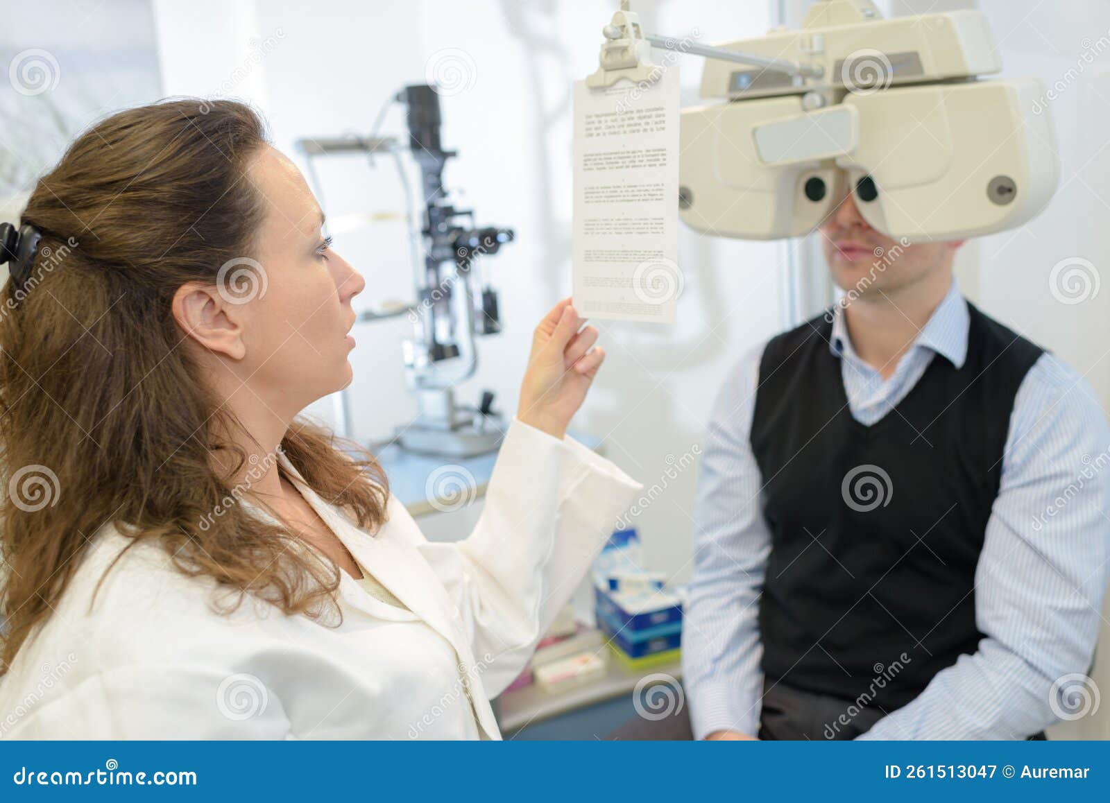Man Reading Text through Phoropter during Eye Test Stock Image - Image ...