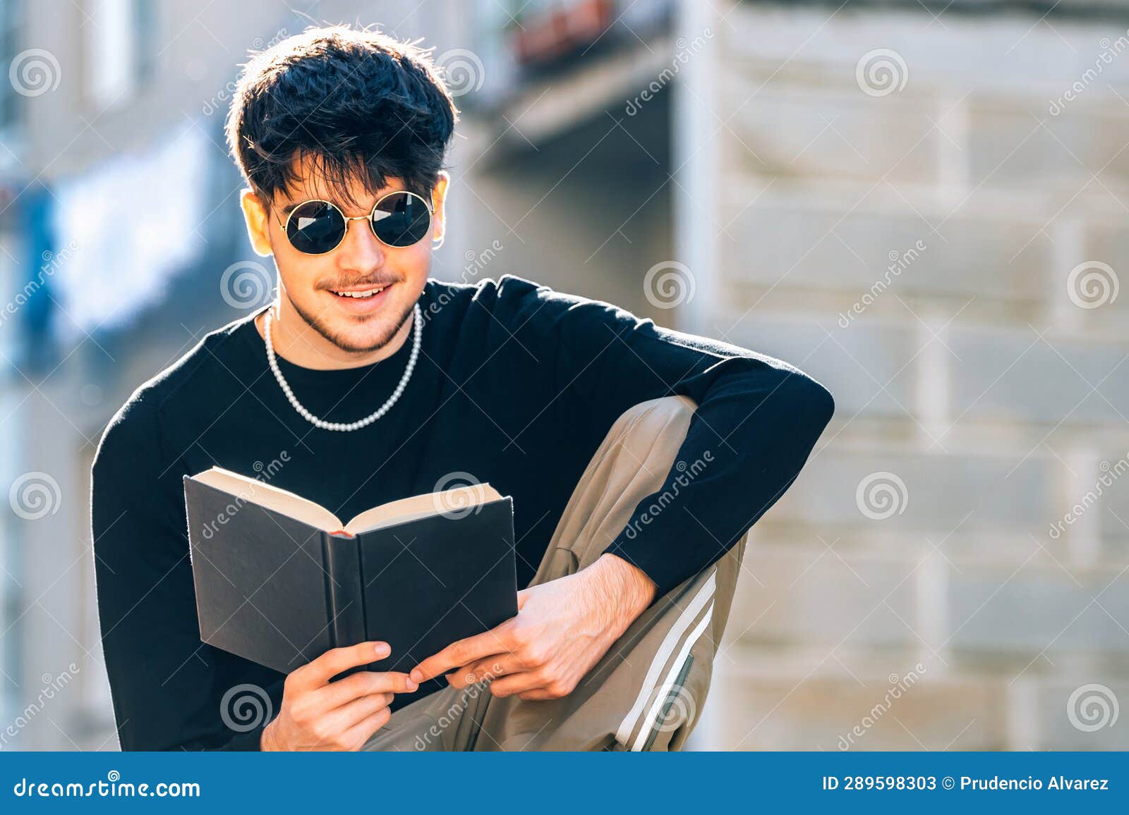 Man Reading with Textbook Outdoors Stock Image - Image of summer ...