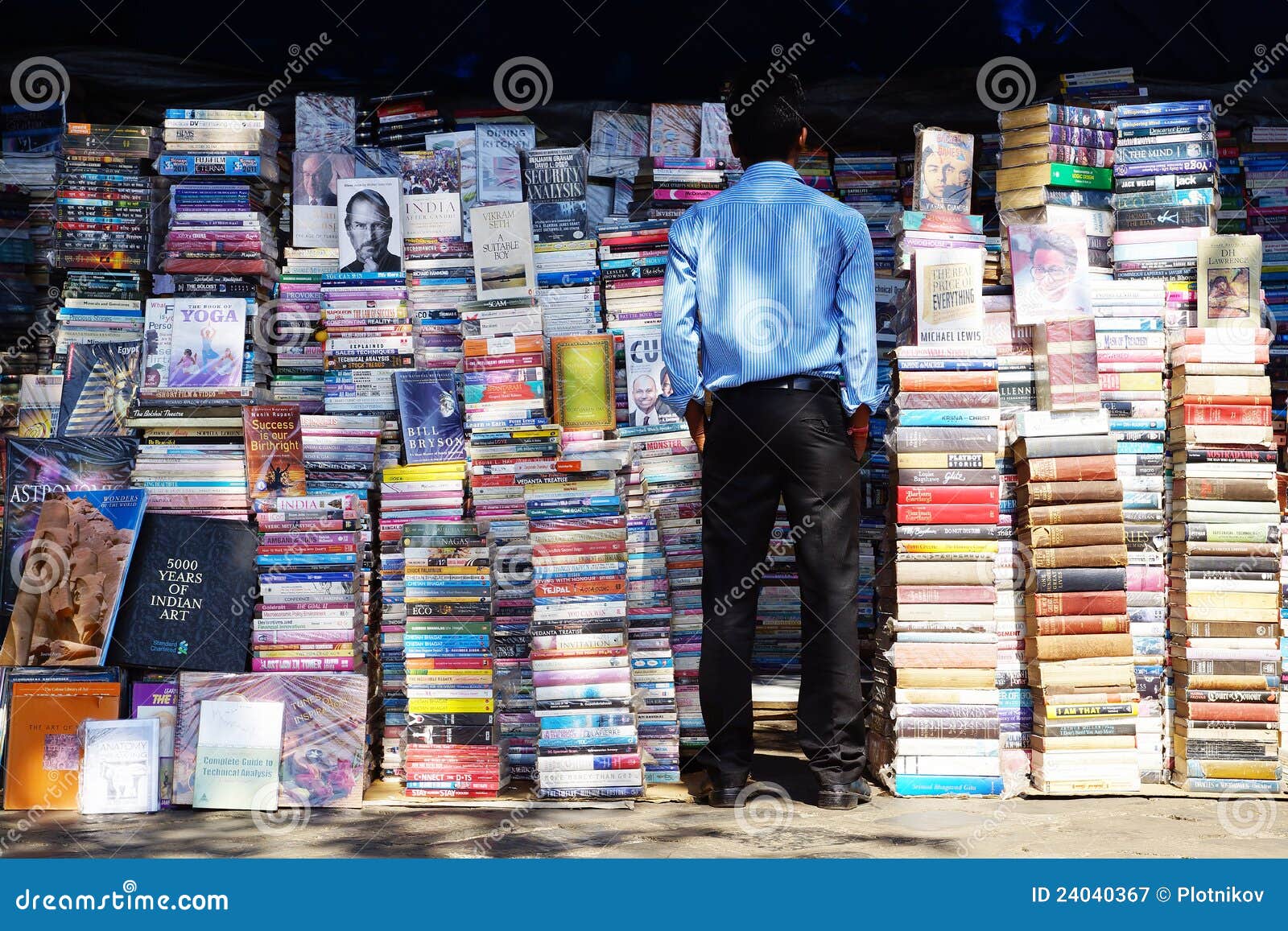 Man Reading the Titles of Books. Editorial Photography - Image of ...