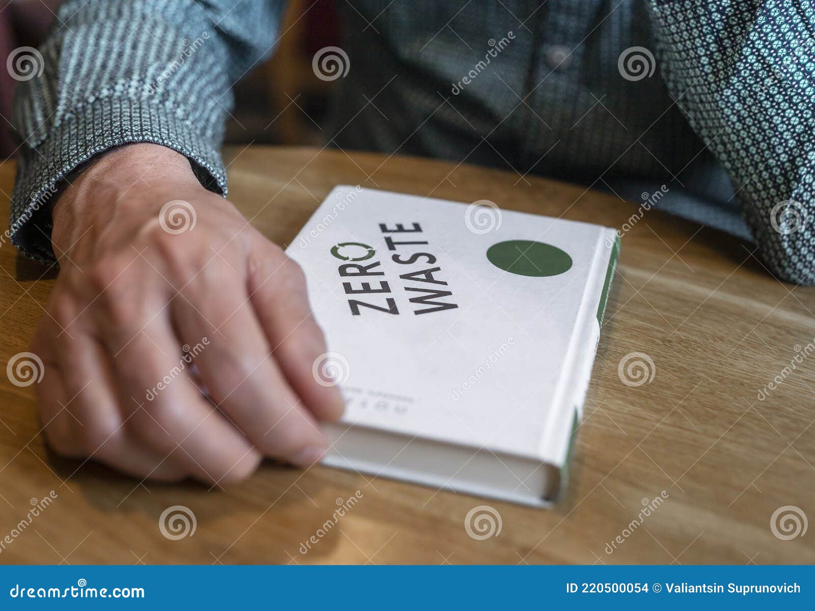 Man Reading Zero Waste Book in Cafe, Closeup. Eco Education Concept ...