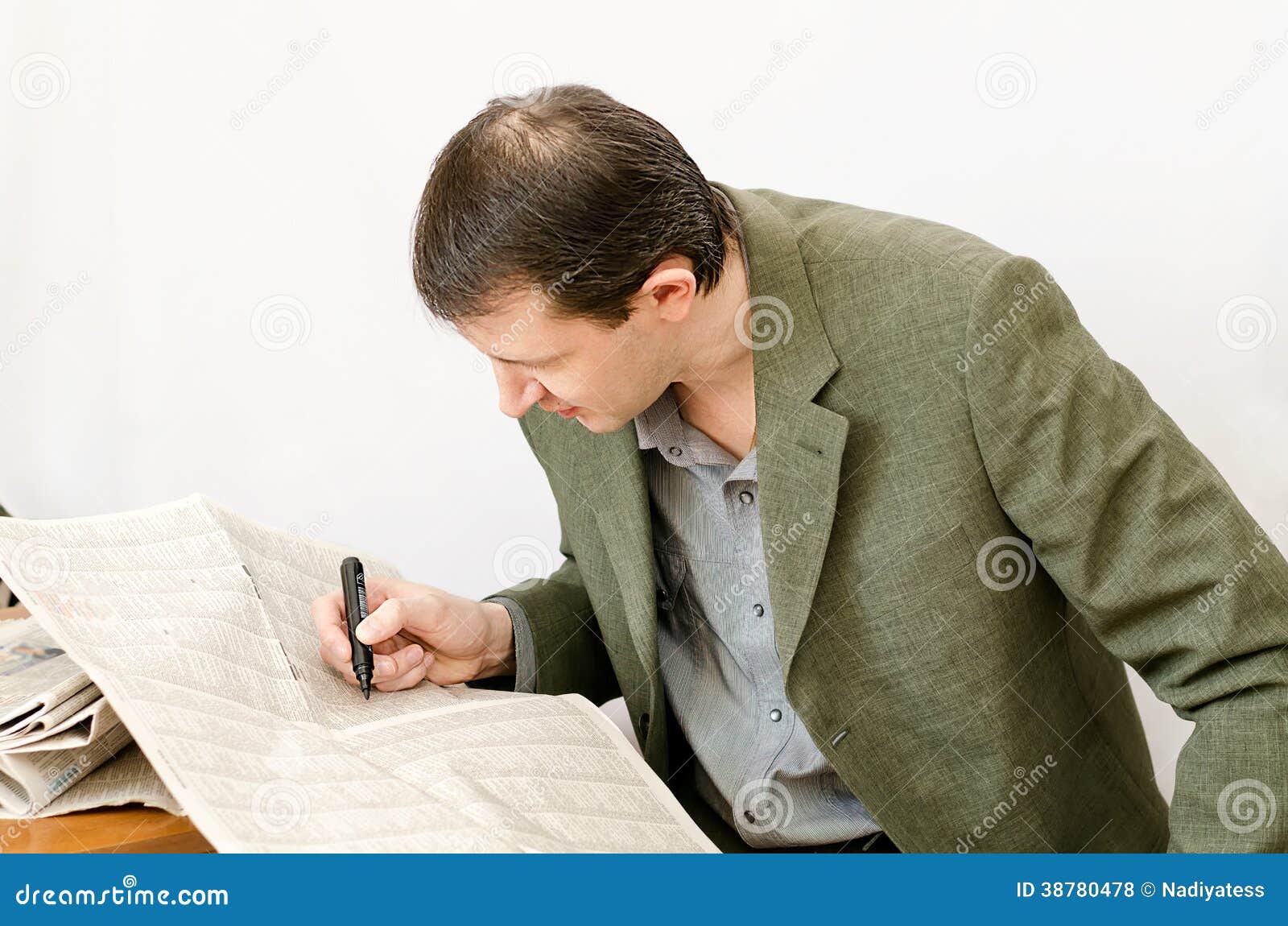 The Man Reads the Newspaper at a Table Stock Photo - Image of table ...
