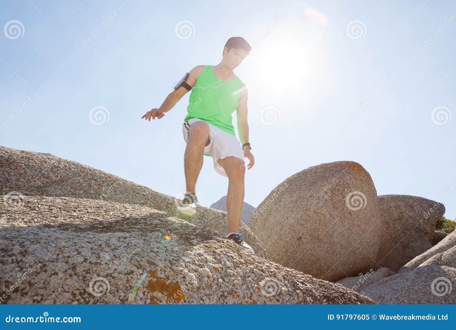 Man Ready To Jump from Rock Stock Image - Image of rock, runner: 91797605