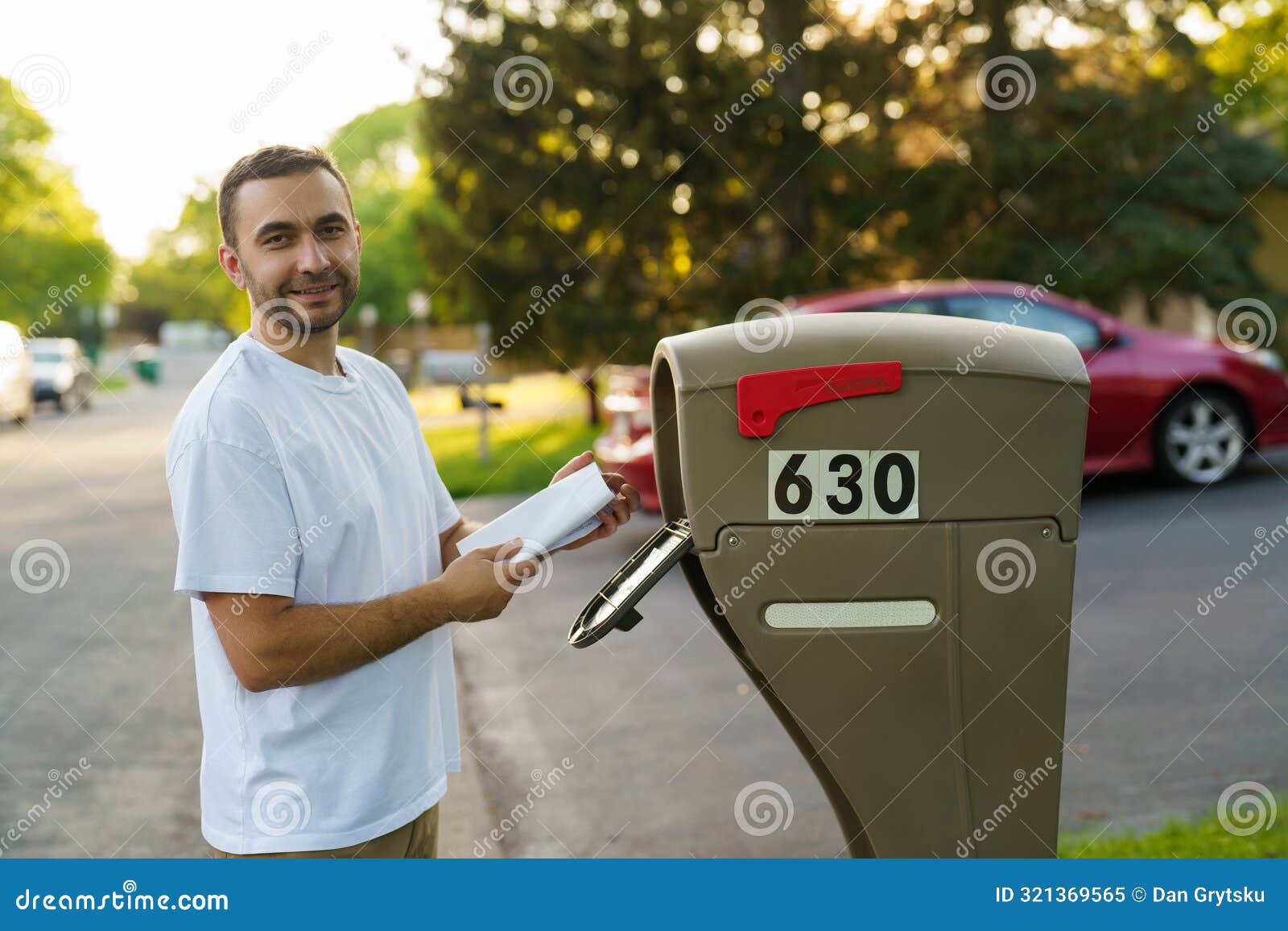 Man Receiving Letters and Bills in Mailbox in Front of House. Mail ...