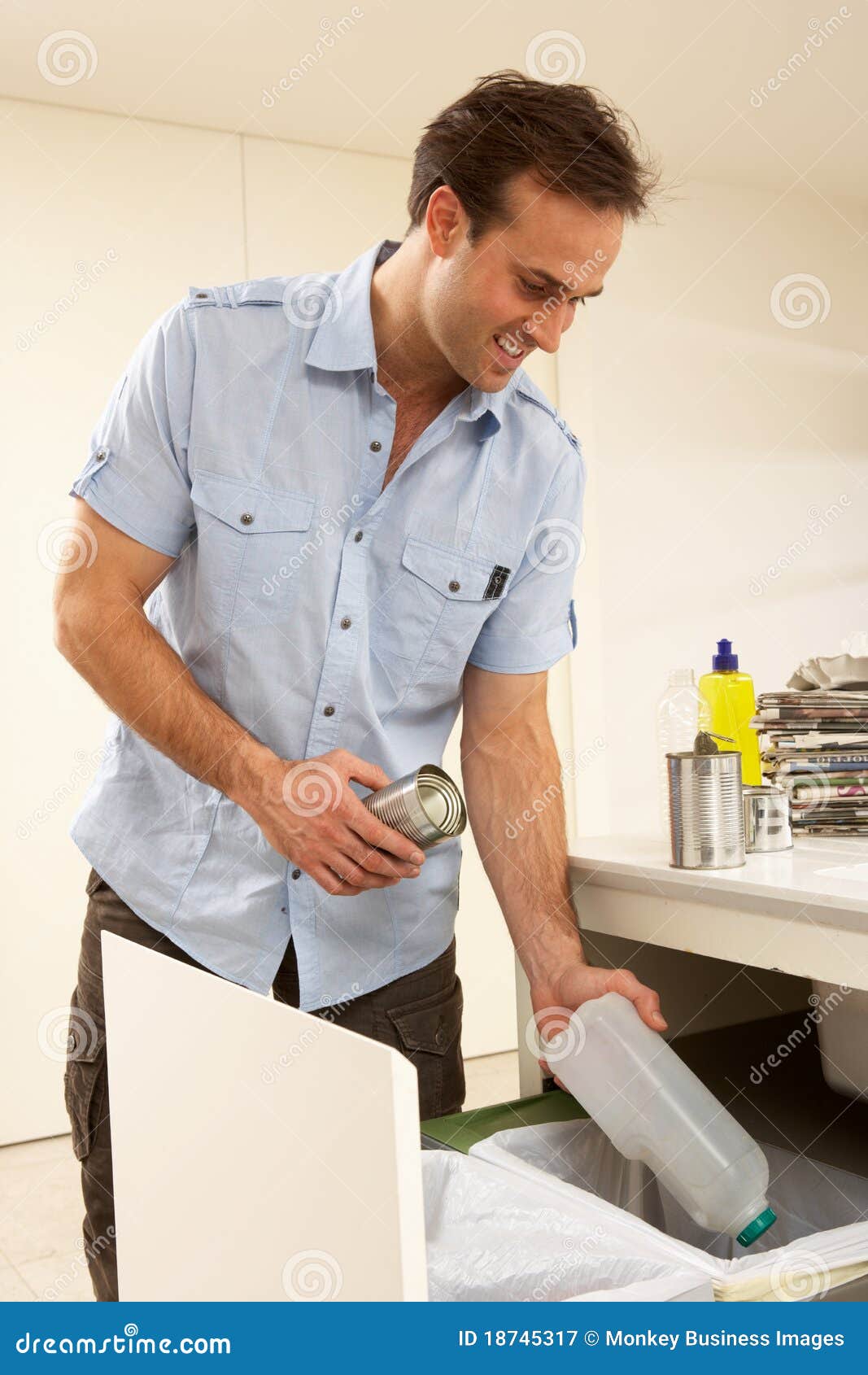 Man Recyling Waste at Home stock image. Image of container - 18745317