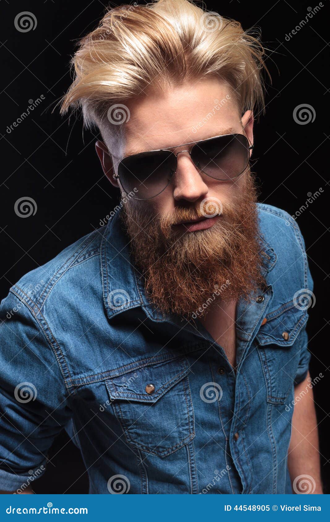 Man With Red Beard Wearing Sunglasses Posing For The Camera Stock