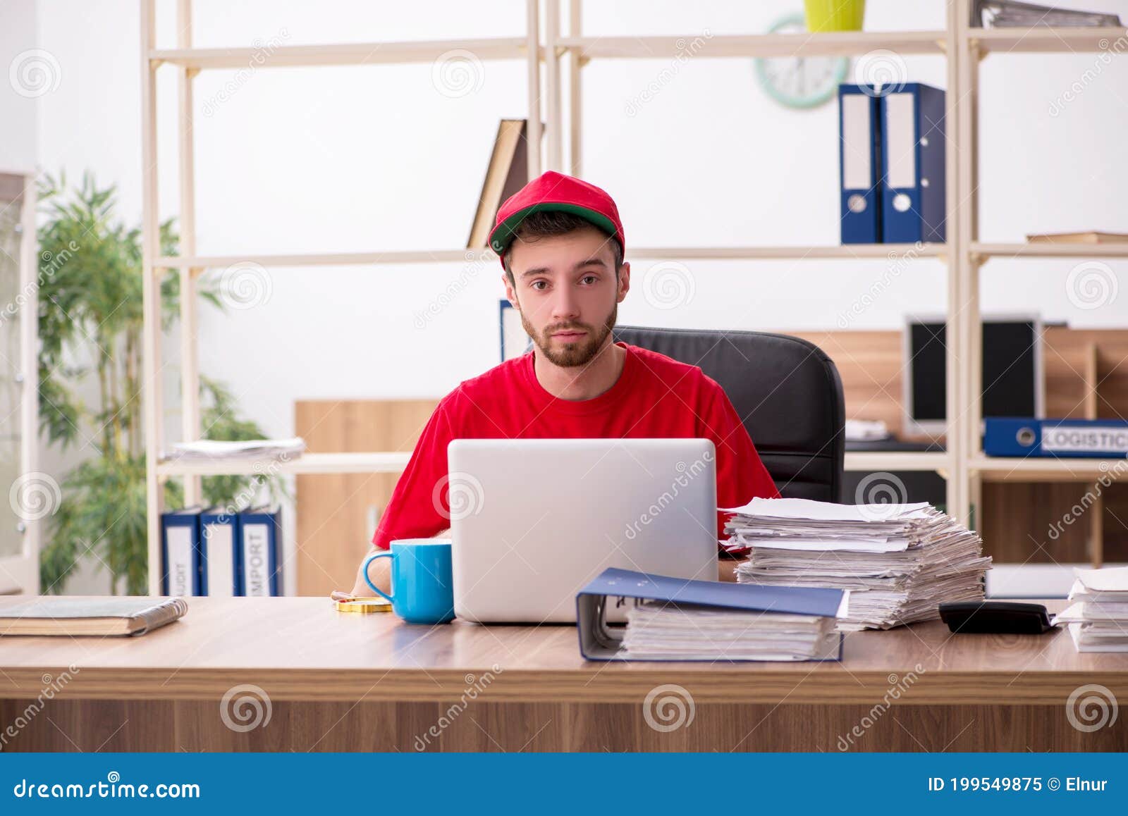 Young Man in Red Cap Sitting in the Office Stock Image - Image of ...