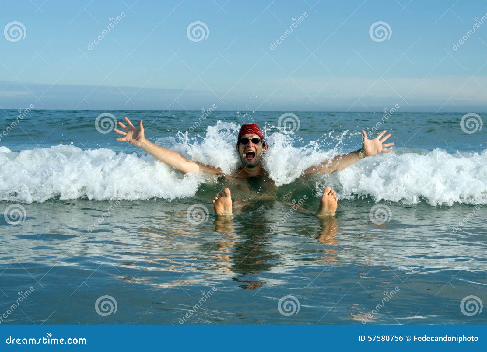 Man with Red Cap in the Waves of the Sea Stock Photo - Image of person ...