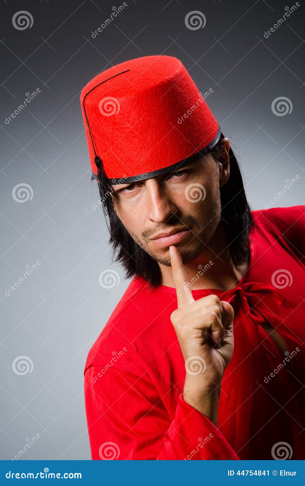 Man in red dress wearing stock image. Image of middle - 44754841