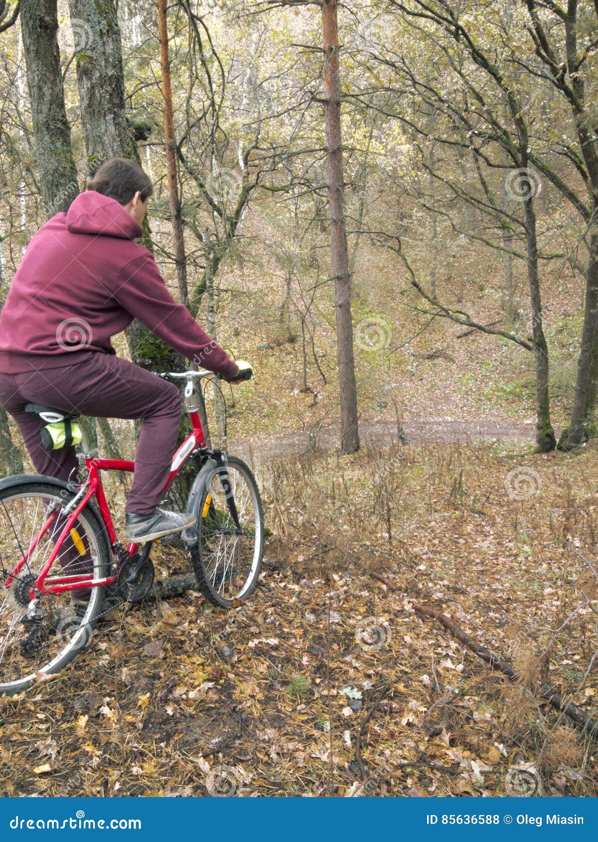 Man in Red is Going To Roll on a Bike with a Steep Slope in the Stock ...
