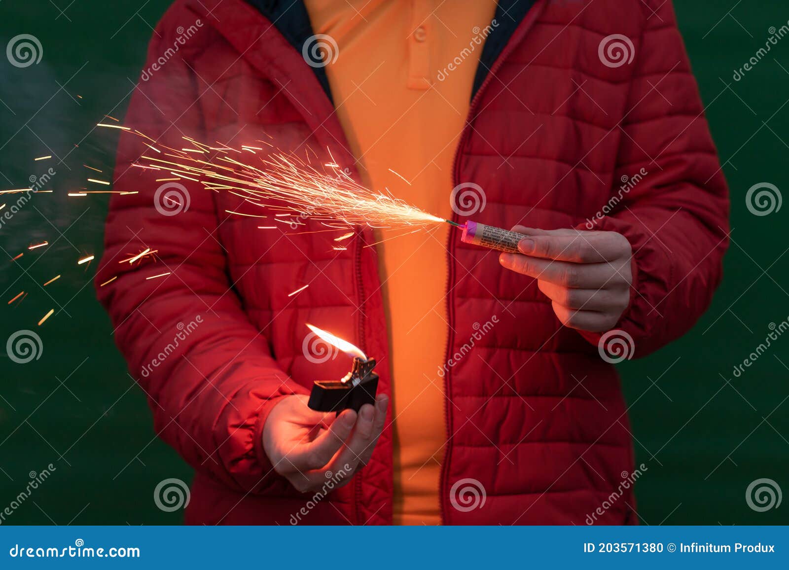 Man in Red Jacket Lighting Up Firecracker in His Hand Stock Photo ...