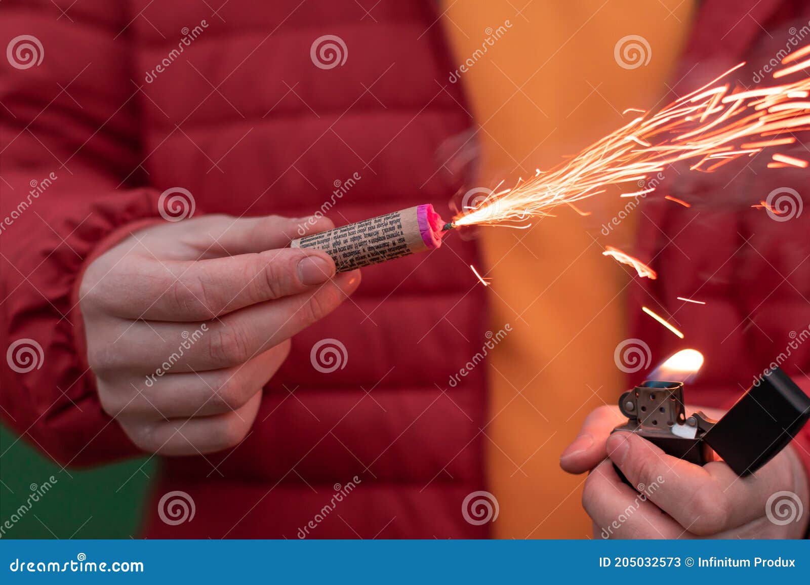 Man in Red Jacket Lighting Up Firecracker in His Hand Stock Image ...