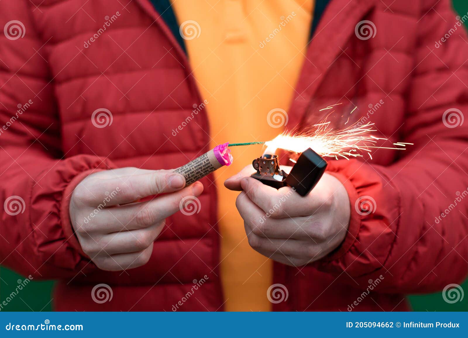 Man in Red Jacket Lighting Up Firecracker in His Hand Stock Photo ...