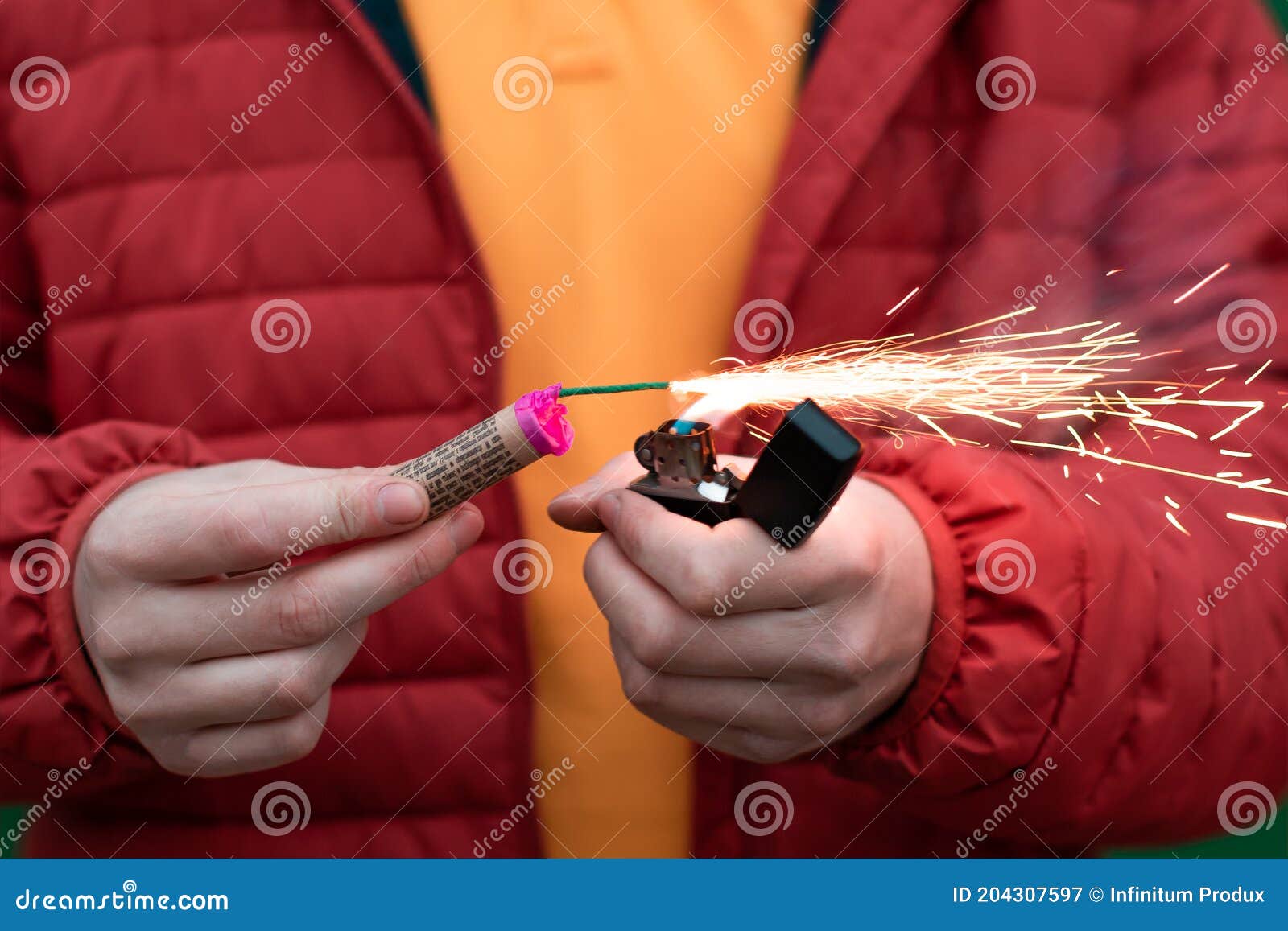 Man in Red Jacket Lighting Up Firecracker in His Hand Stock Image ...