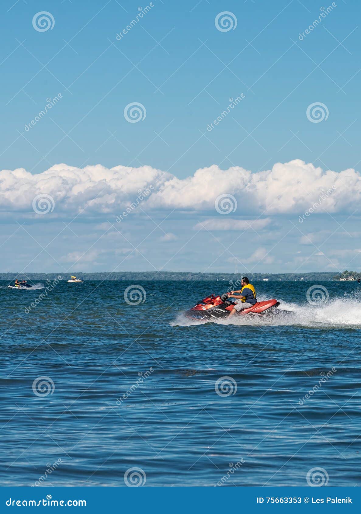 Man a red jet ski editorial stock photo. Image of wake - 75663353