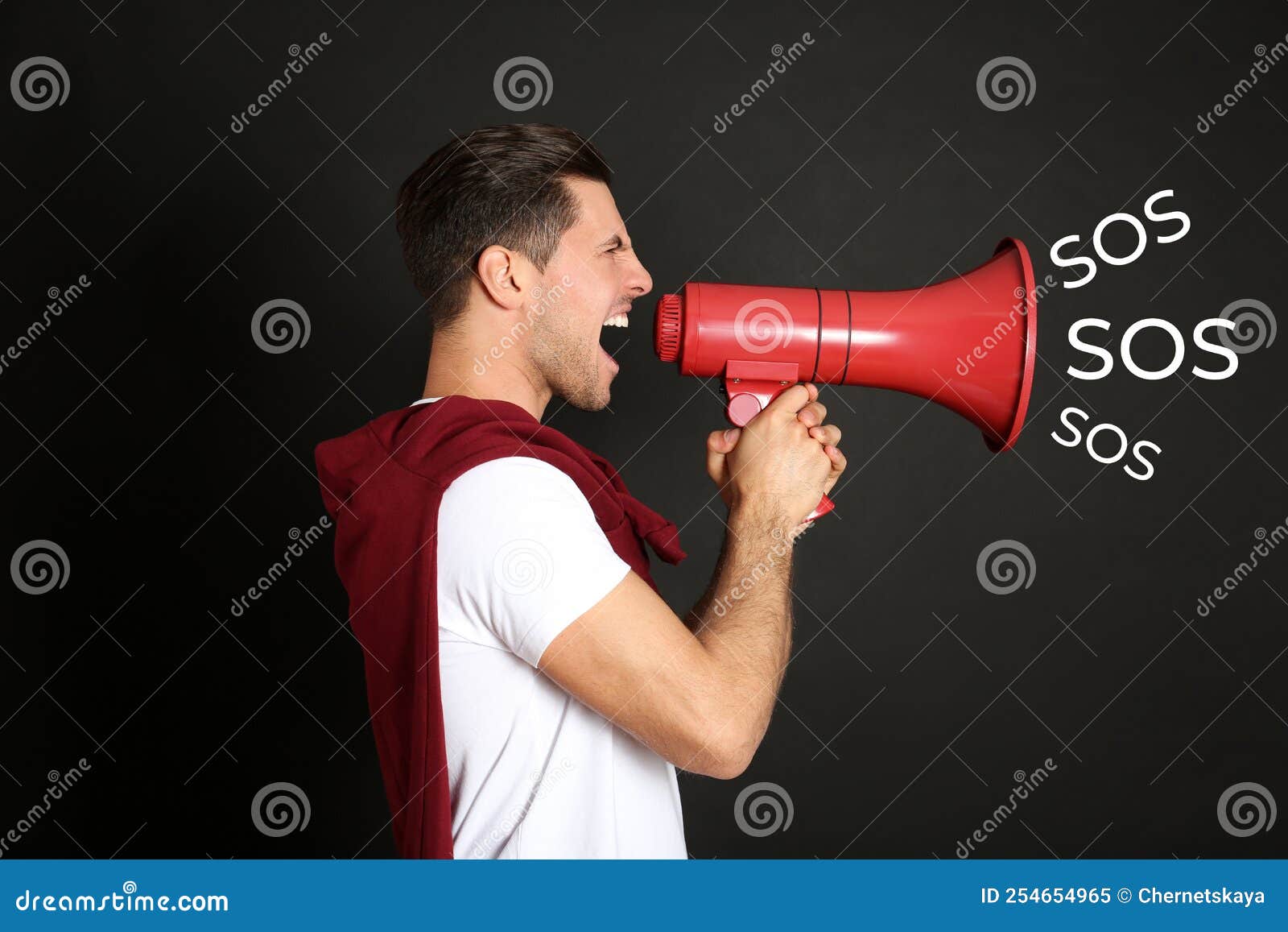 Man with Red Megaphone and Words SOS on Black Background. Asking for ...