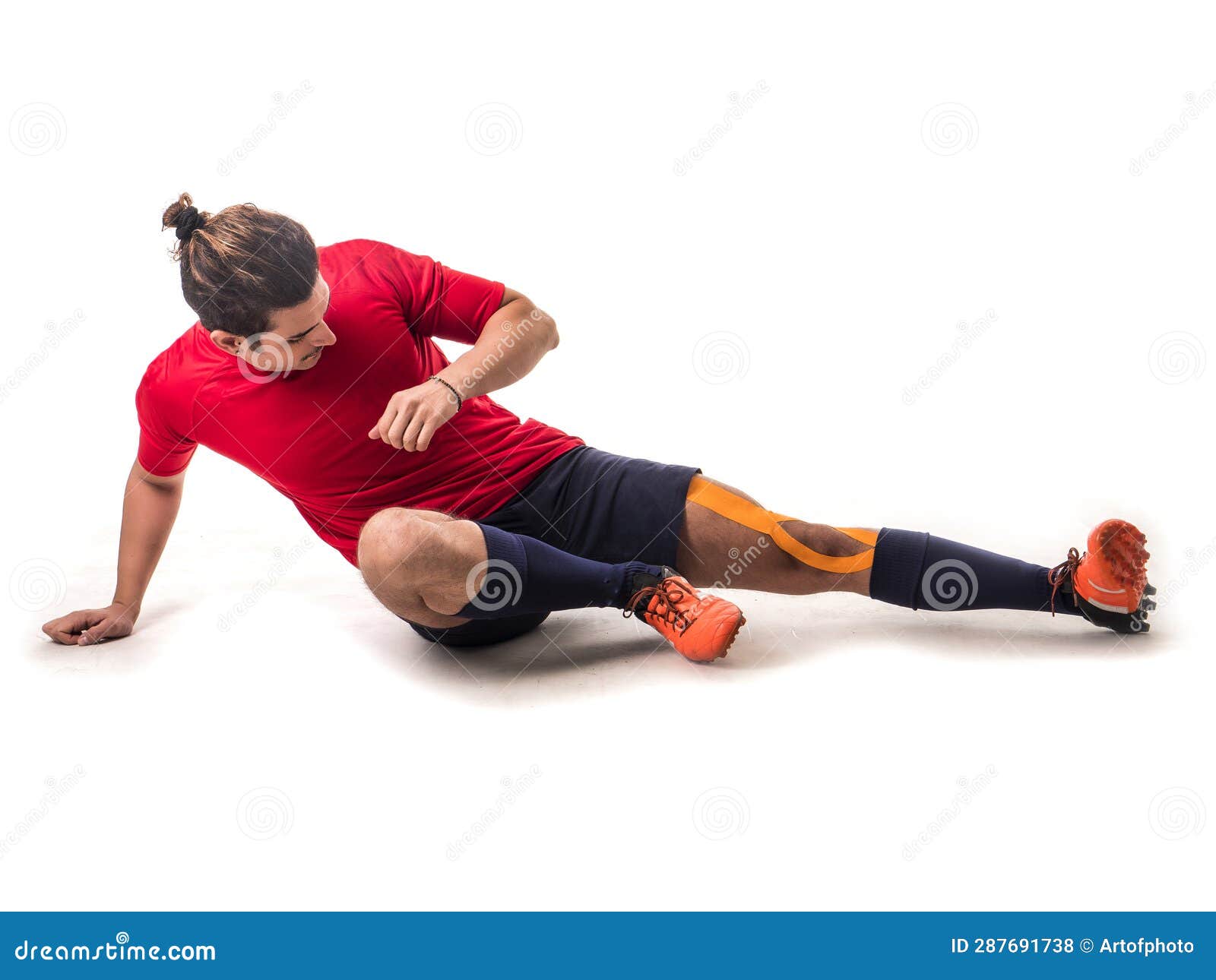 Photo of a Man Performing a Powerful Kick in a Studio Setting Stock ...
