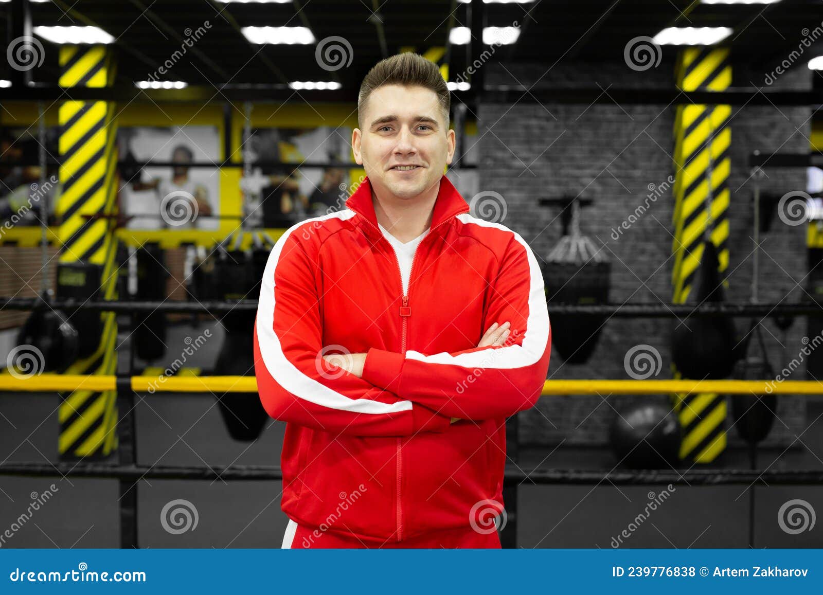 Man in a Red Tracksuit Poses and Has Fun in the Boxing Ring. Stock ...