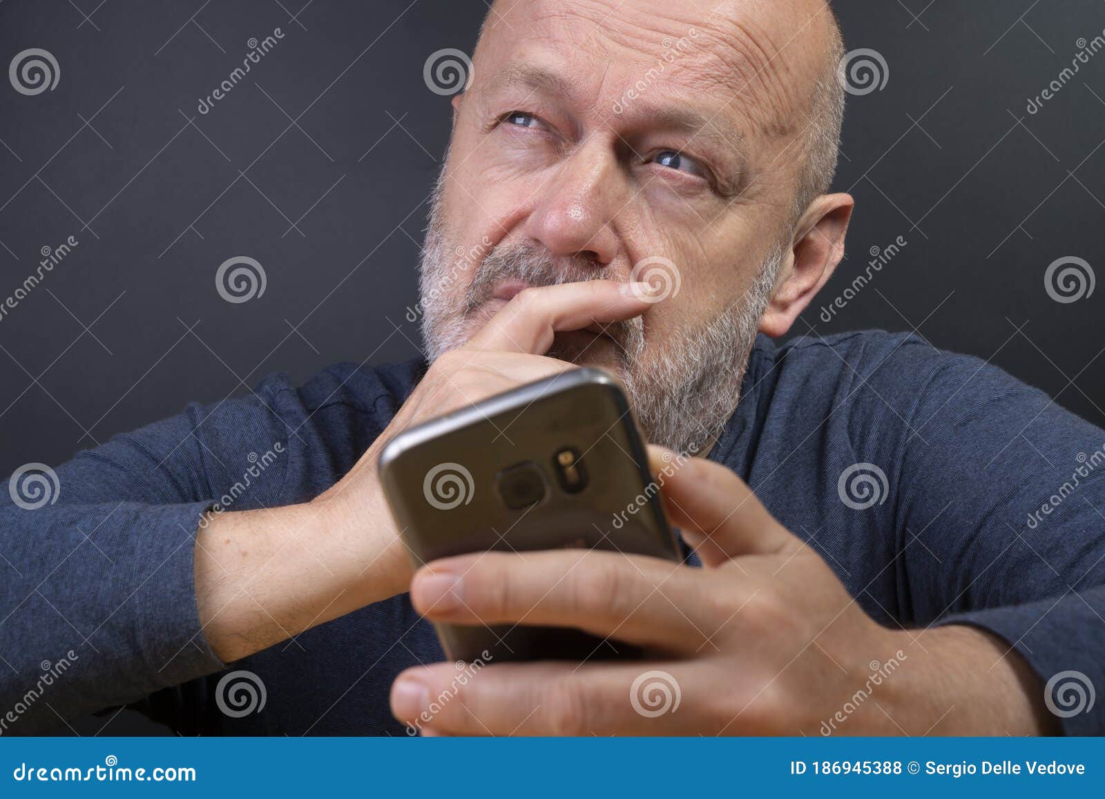 A man while reflecting stock photo. Image of holding - 186945388