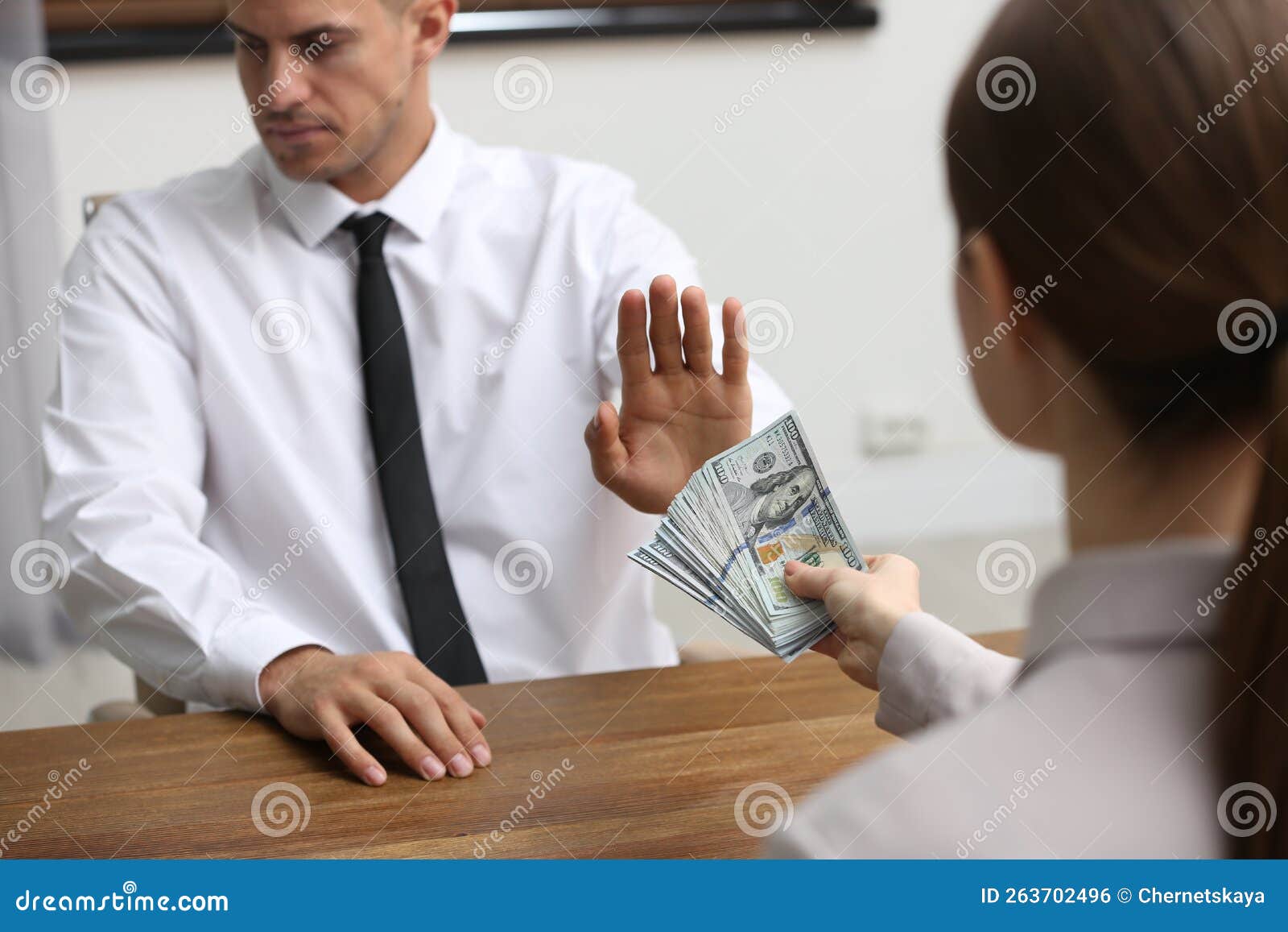 Man Refusing To Take Bribe at Table Indoors Stock Photo - Image of ...