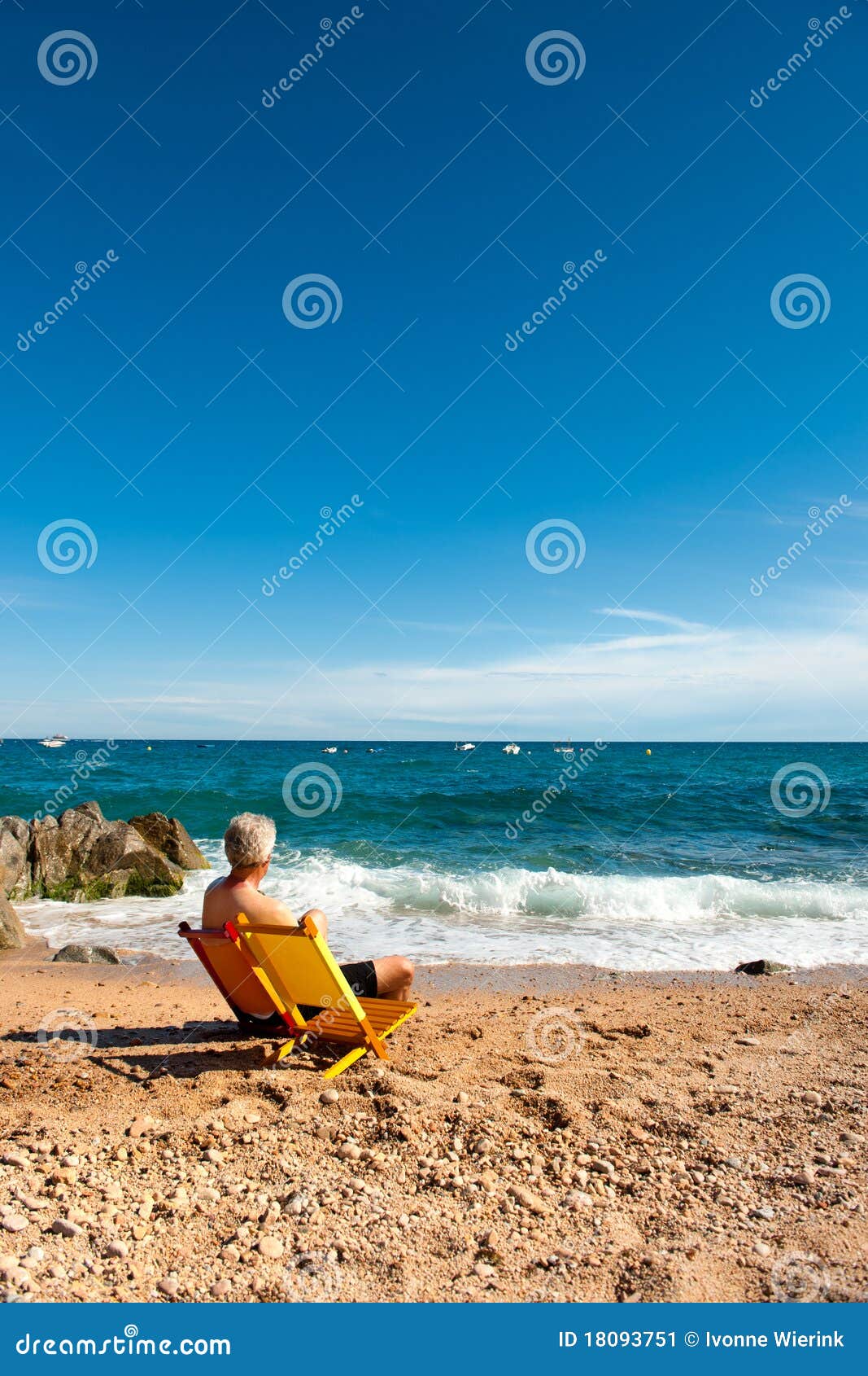 Man relaxing at the beach stock image. Image of sitting - 18093751