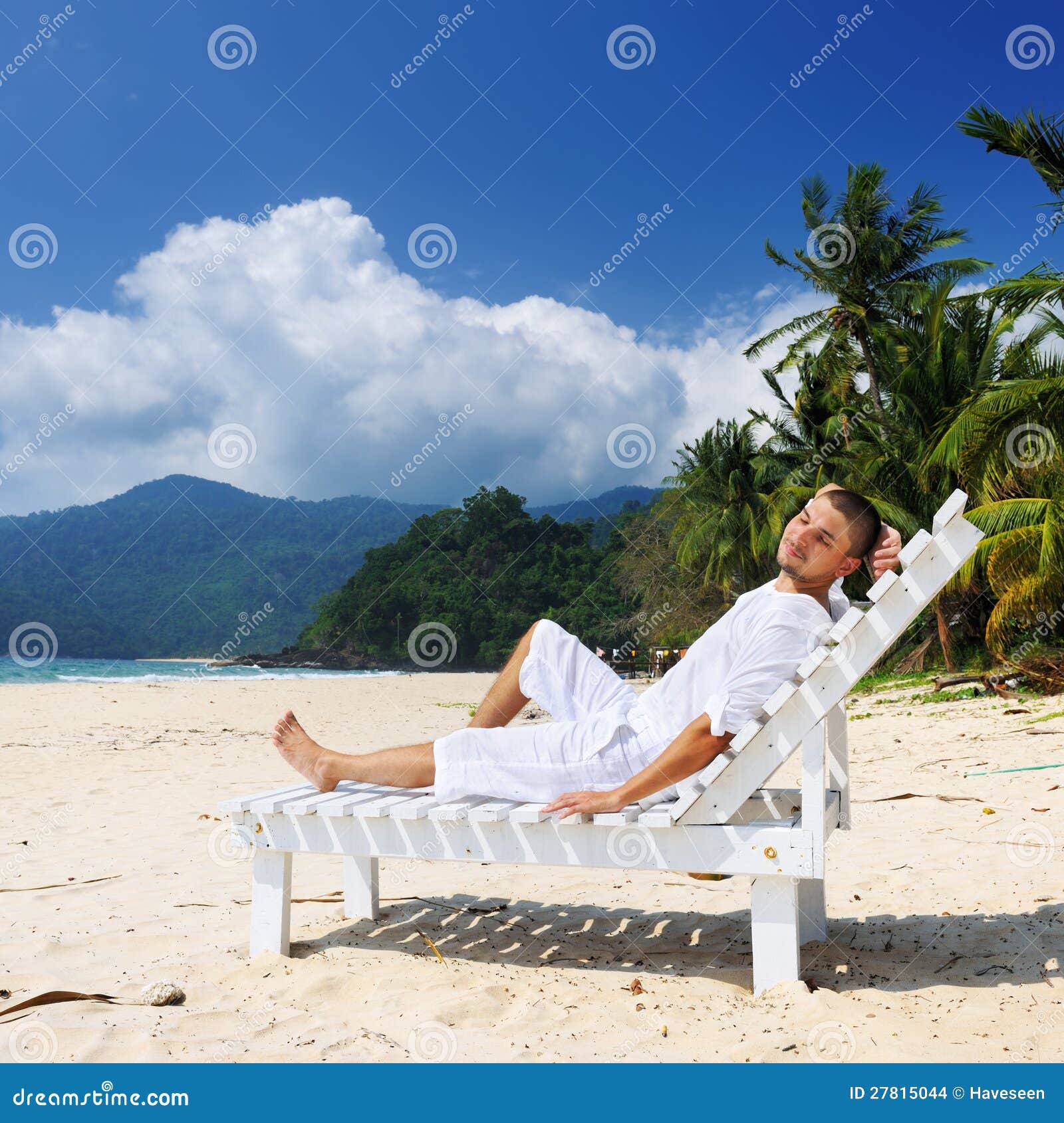Man relaxing on a beach stock photo. Image of people - 27815044