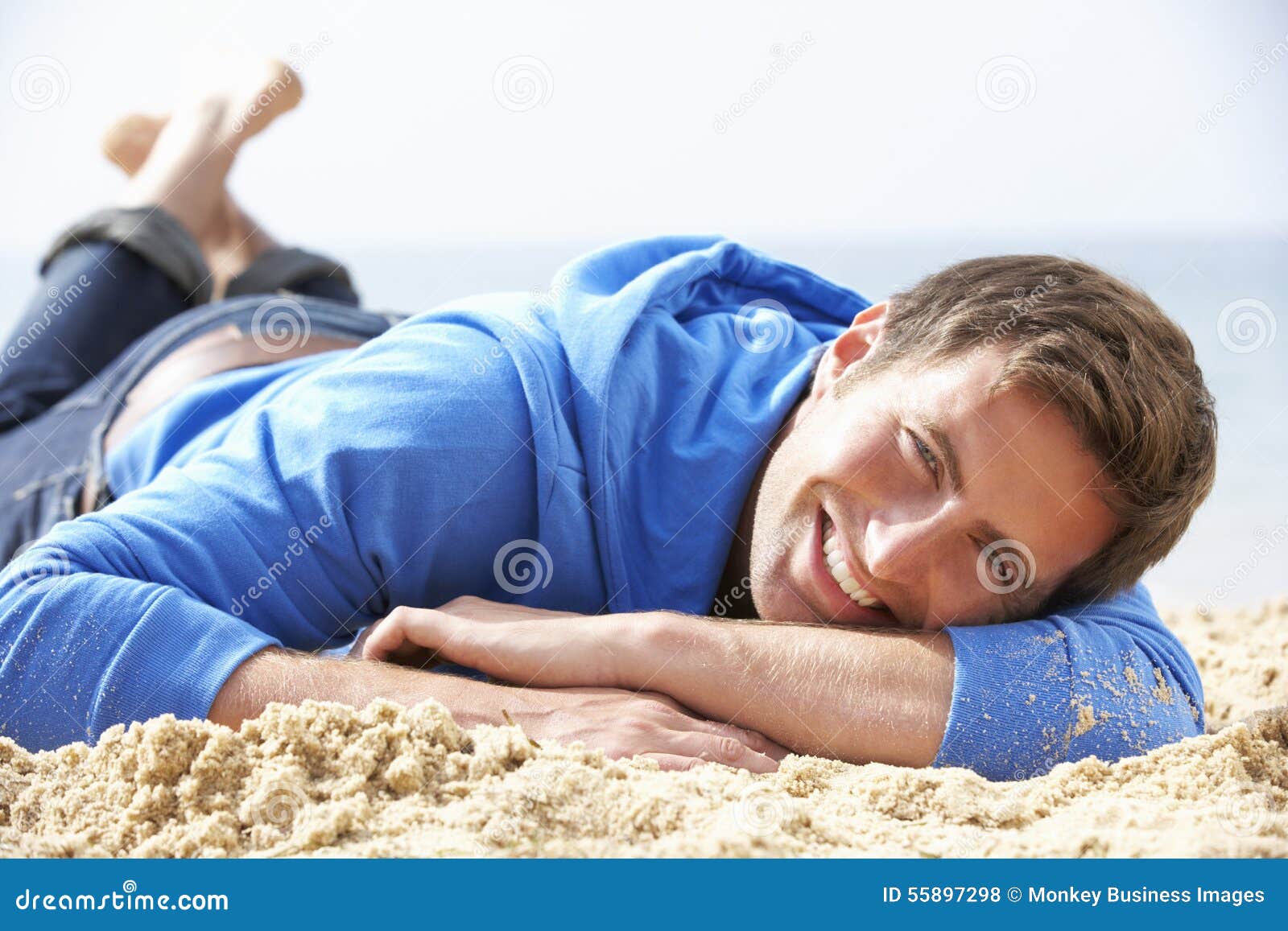 Man Relaxing on Beach stock photo. Image of horizontal - 55897298
