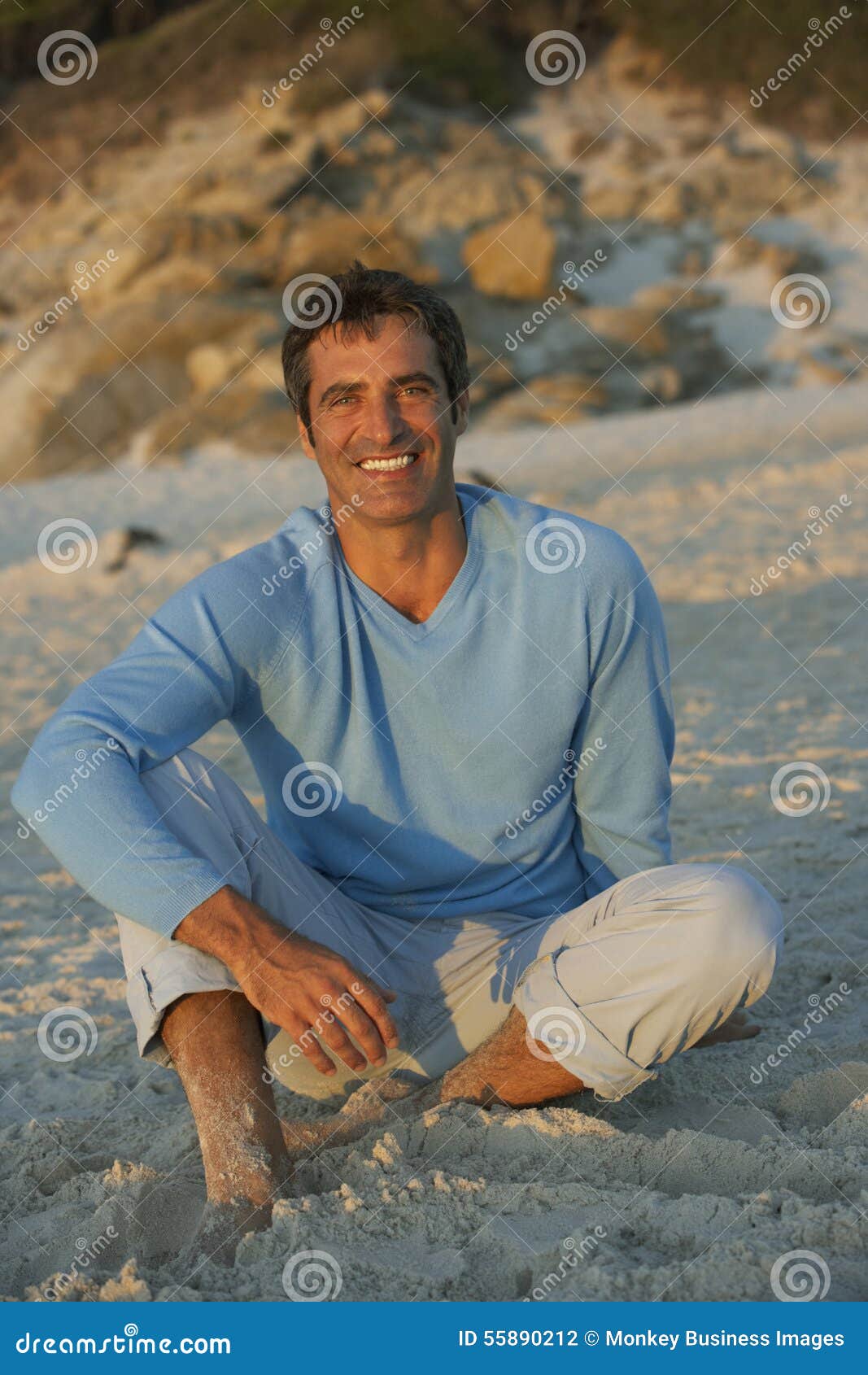 Man Relaxing on Beach in Evening Light Stock Photo - Image of lifestyle ...