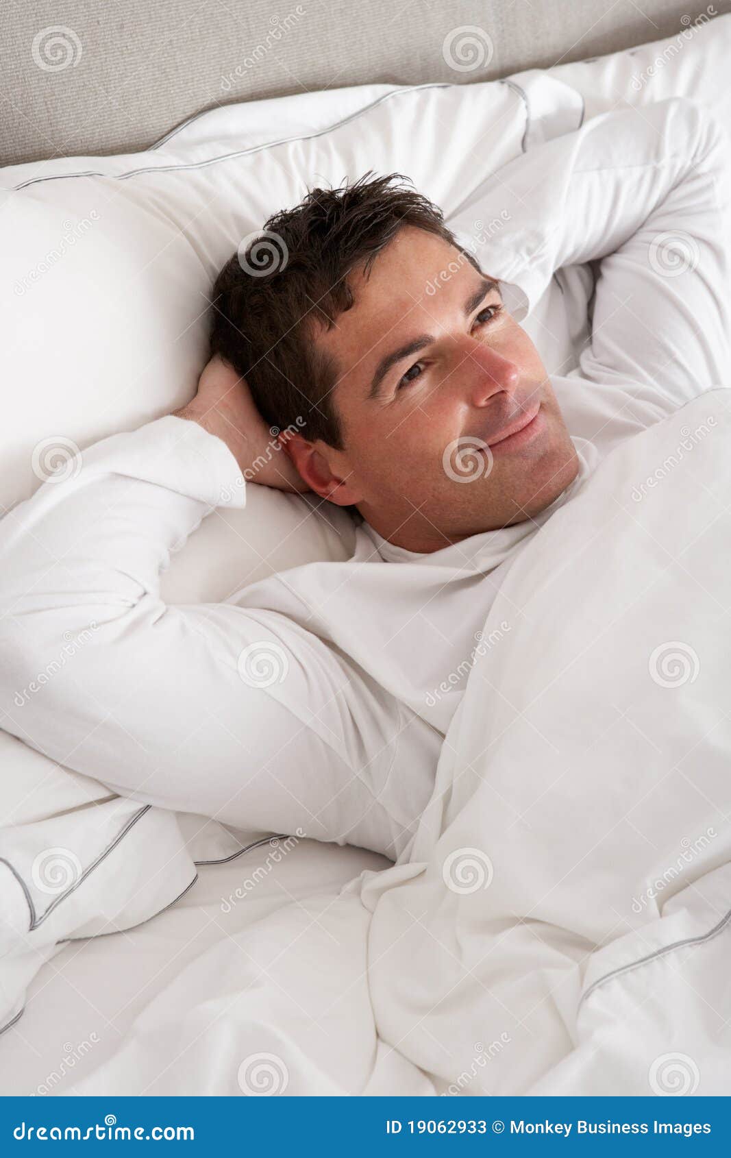 Man Relaxing in Bed stock image. Image of dreaming, peaceful - 19062933