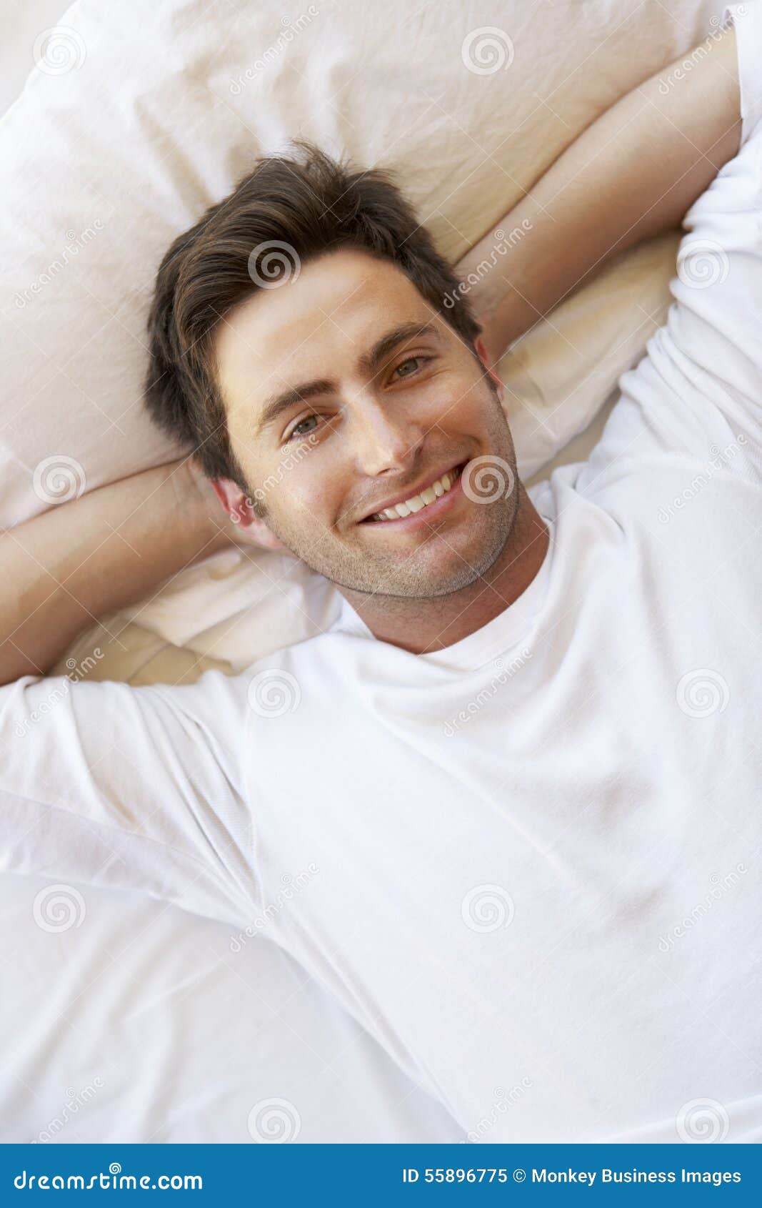 Man Relaxing in Bed stock image. Image of relaxed, bedclothes - 55896775