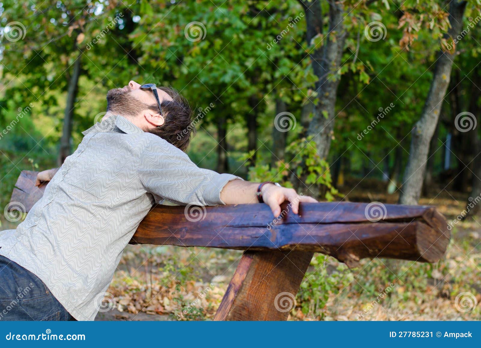 Man relaxing on bench stock image. Image of sleeping - 27785231