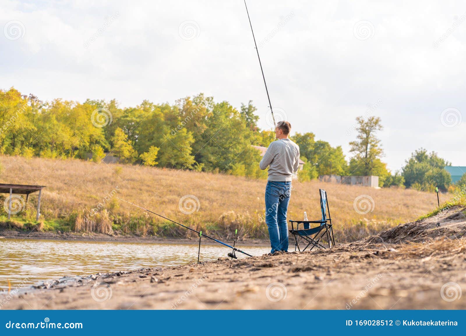 Man Relaxing and Fishing by Lakeside Stock Photo - Image of pond, hobby ...