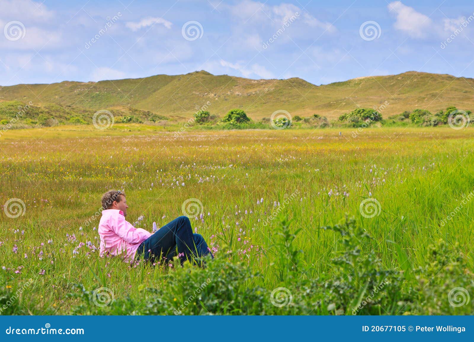 Man Relaxing in a Grassland Stock Image - Image of grass, dunes: 20677105
