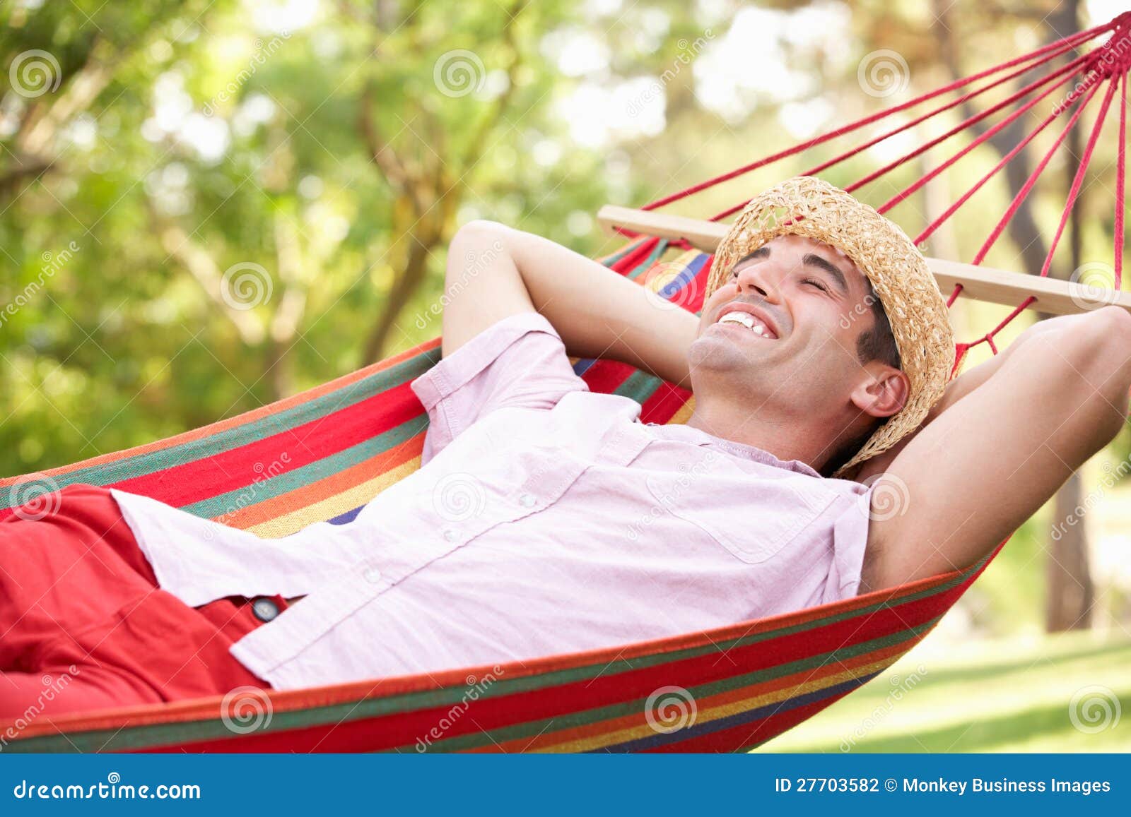 Man Relaxing in Hammock stock photo. Image of person - 27703582