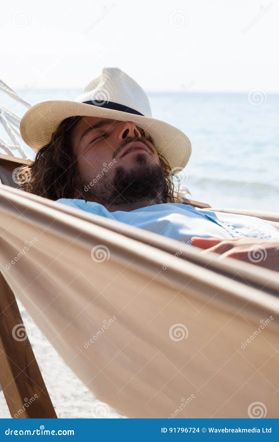 Man relaxing in hammock stock photo. Image of tourism - 91796724
