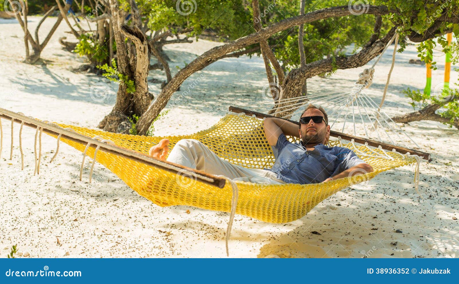 Man Relaxing in a Hammock on the Beach on Holidays. Stock Photo - Image ...